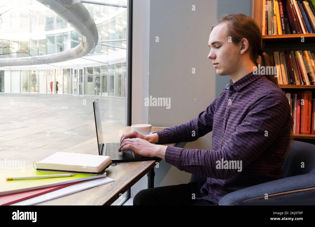 Boy student speaking phone Stock Photo - Alamy