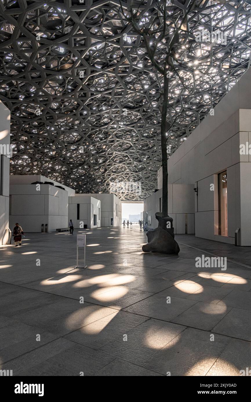 View under the dome of The Louvre in Abu Dhabi, with the Leaves of ...