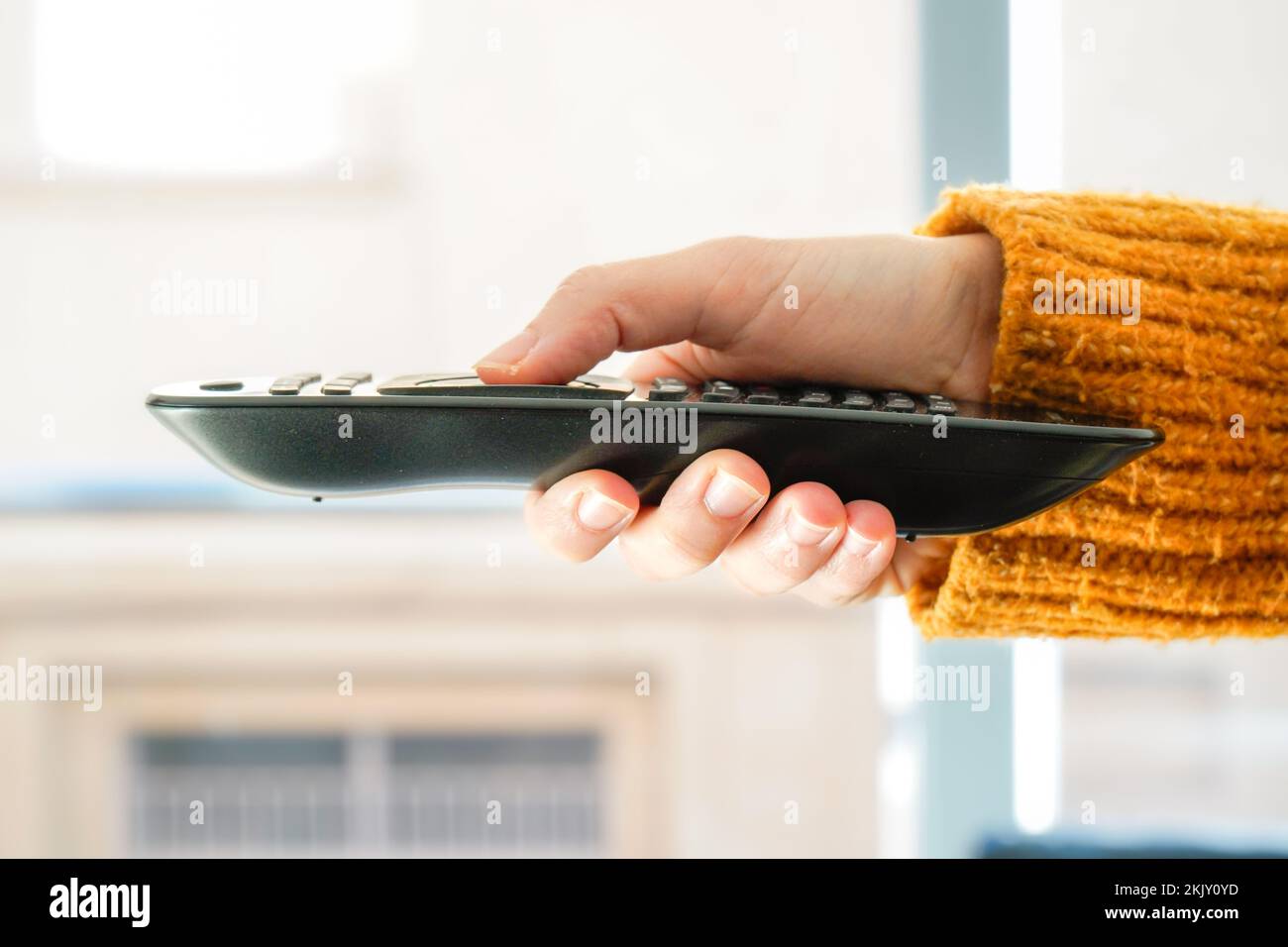 changing channel with remote control at home Stock Photo - Alamy