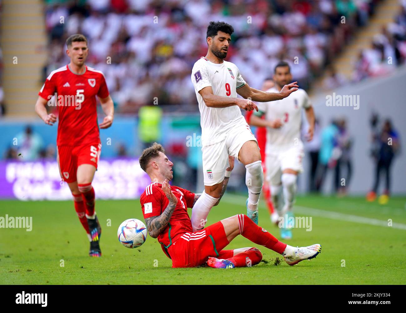 Wales' Joe Rodon (centre) fouls Iran's Mehdi Taremi during the FIFA ...