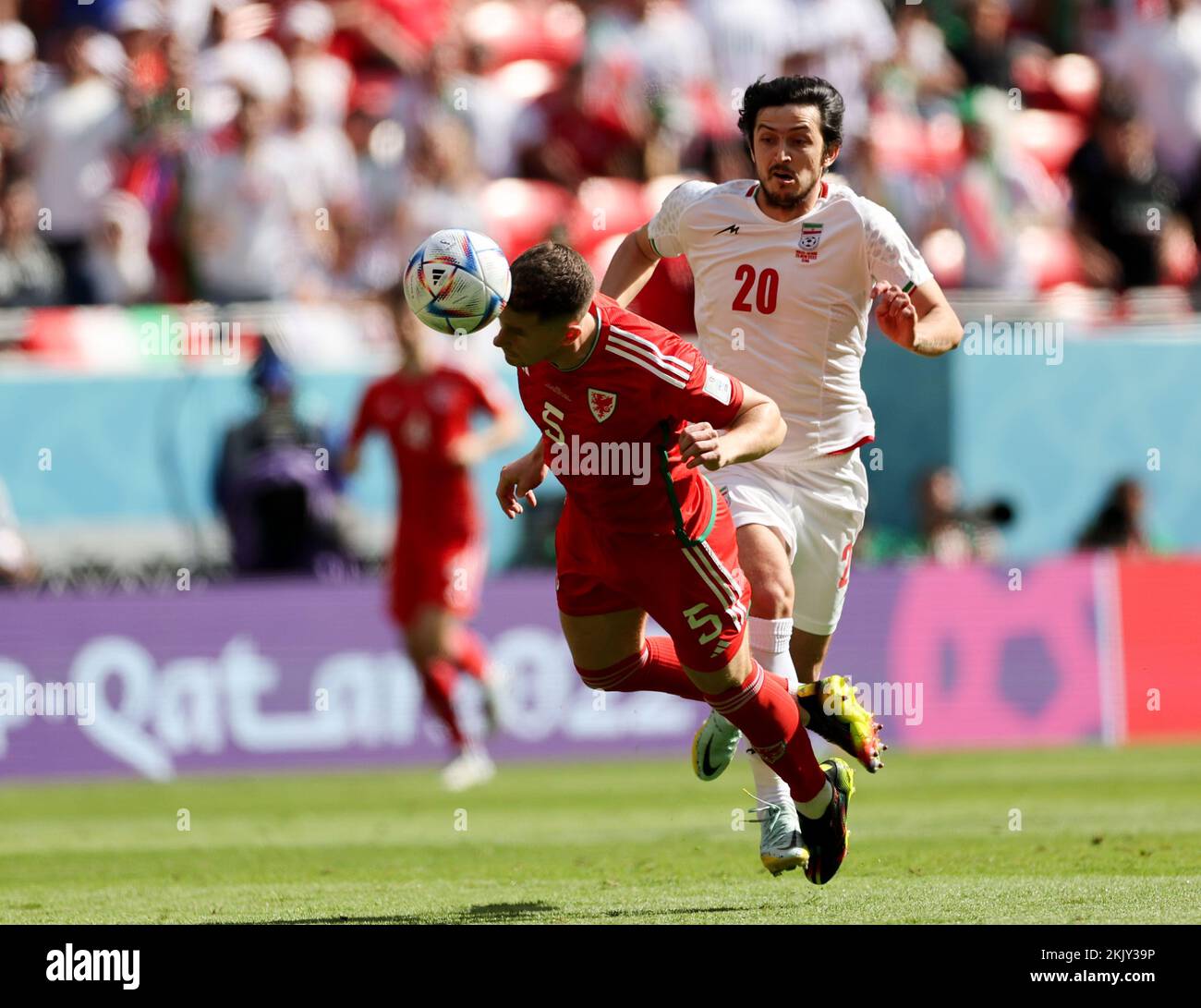 Al Rayyan, Qatar. 25th Nov, 2022. Chris Mepham (L) of Wales vies for a ...