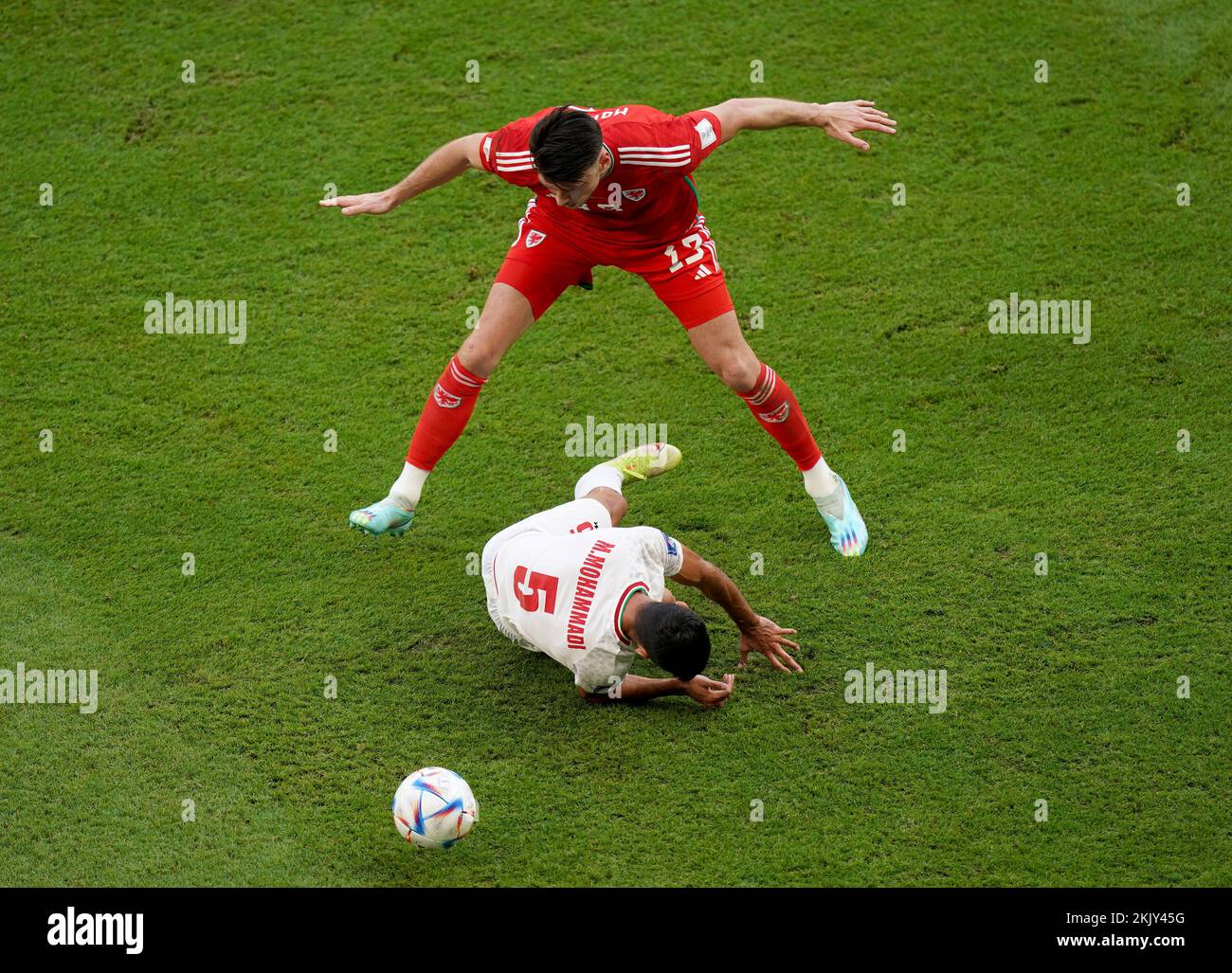 Wales' Kieffer Moore battles with Iran’s Milad Mohammadi during the ...