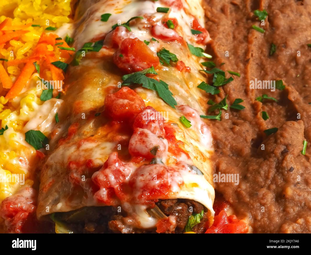 mexican burritos with refried black beans and rice Stock Photo - Alamy