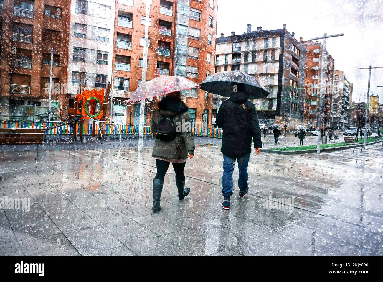 people with an umbrella in rainy days in Bilbao city, basque country ...
