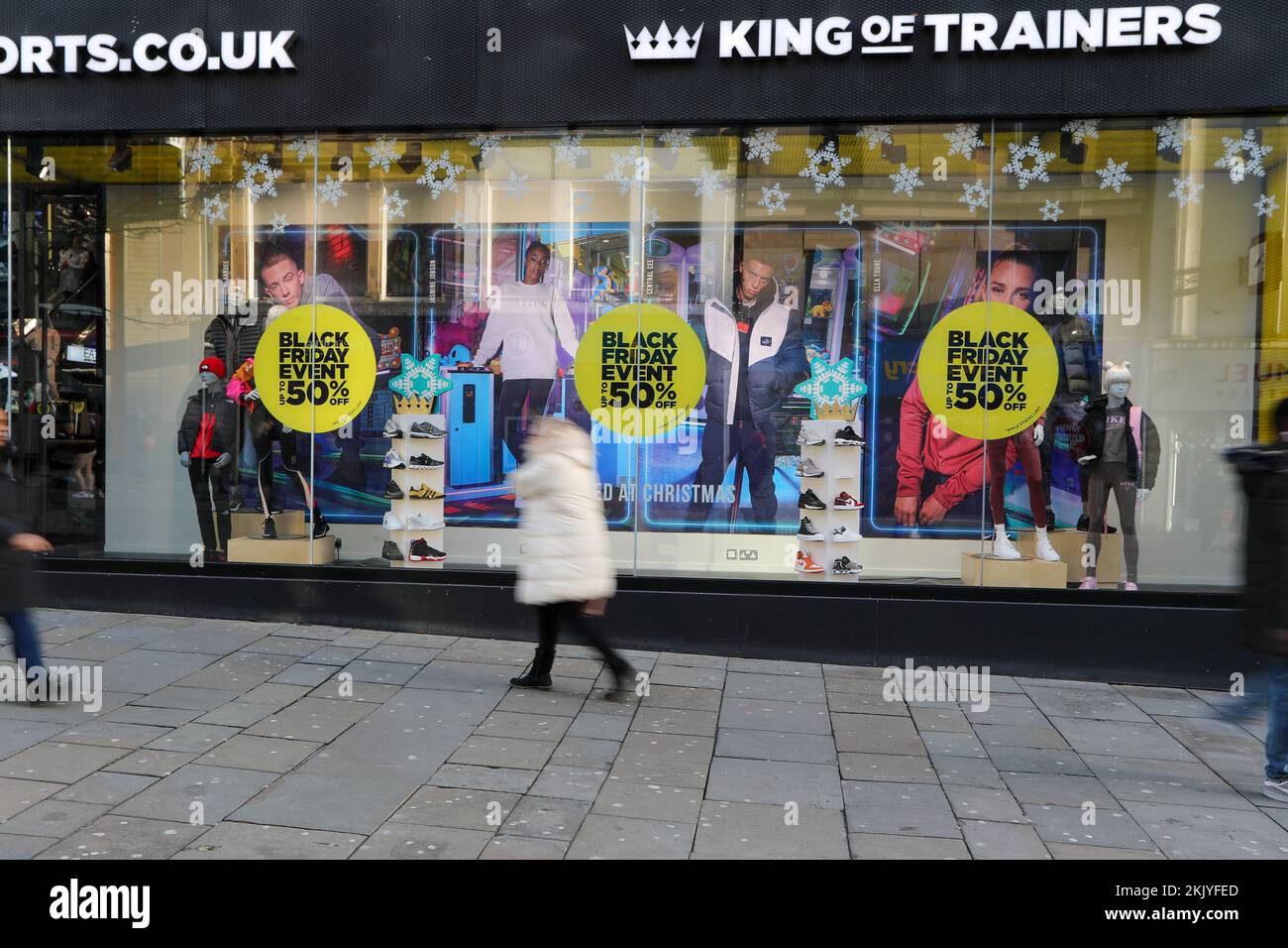 Black Friday Shoppers pass JD Sports Window in Newcastle at Newcastle ...