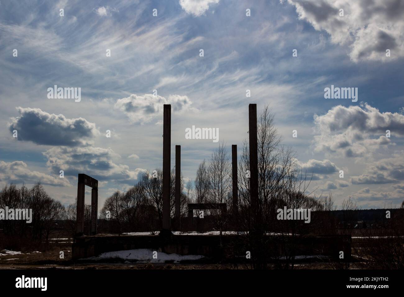 Silhouette of an unfinished building against the background of clouds ...