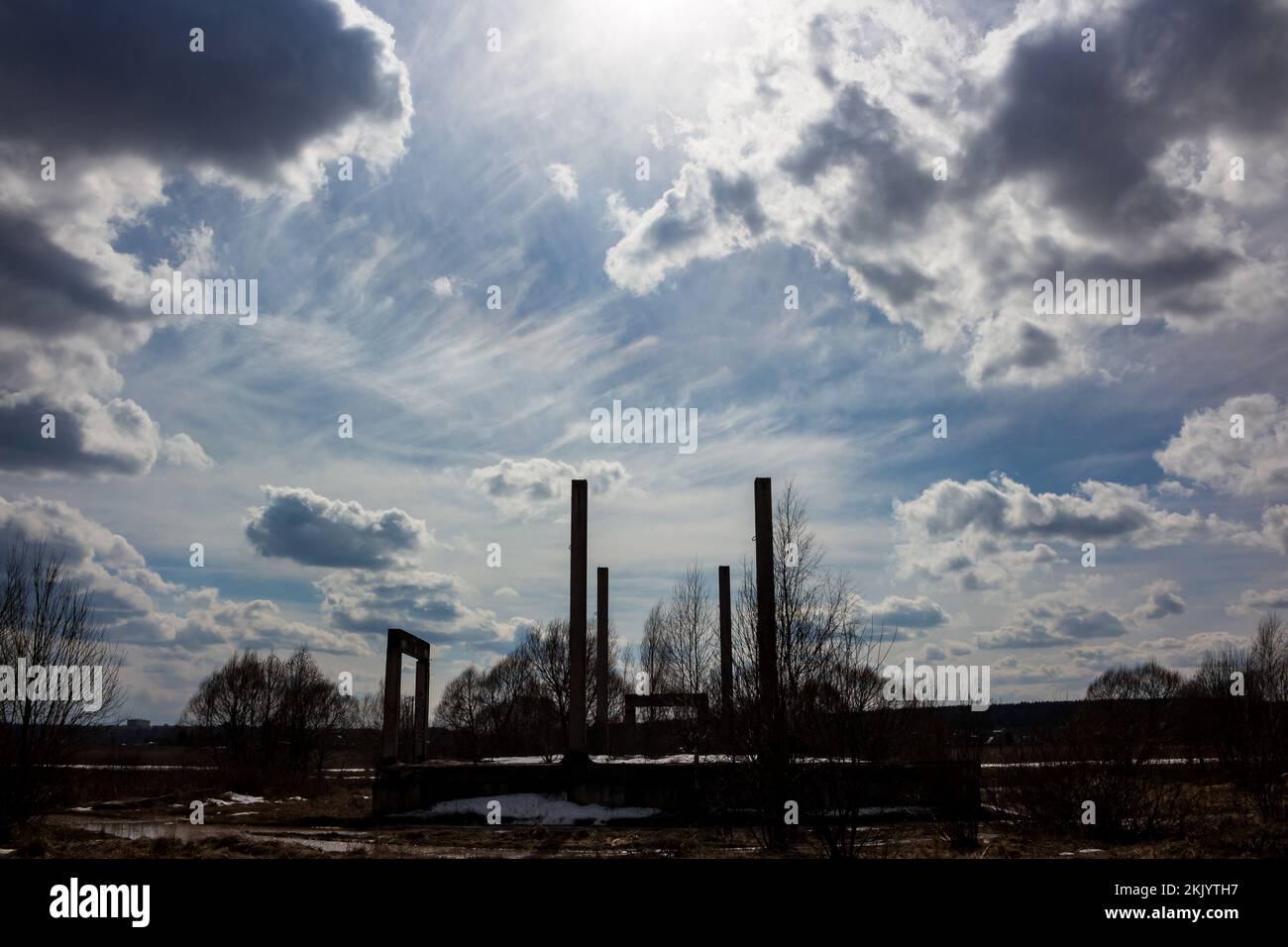 Silhouette of an unfinished building against the background of clouds ...