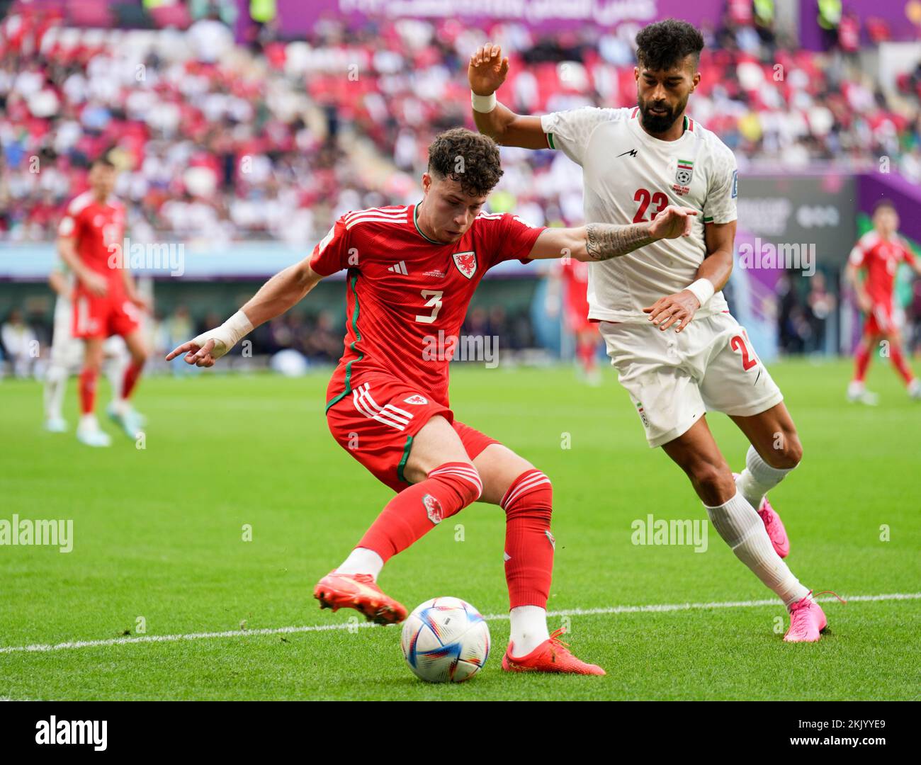 Al Rayyan, Qatar. 25th Nov, 2022. Neco Williams (L) of Wales vies with ...