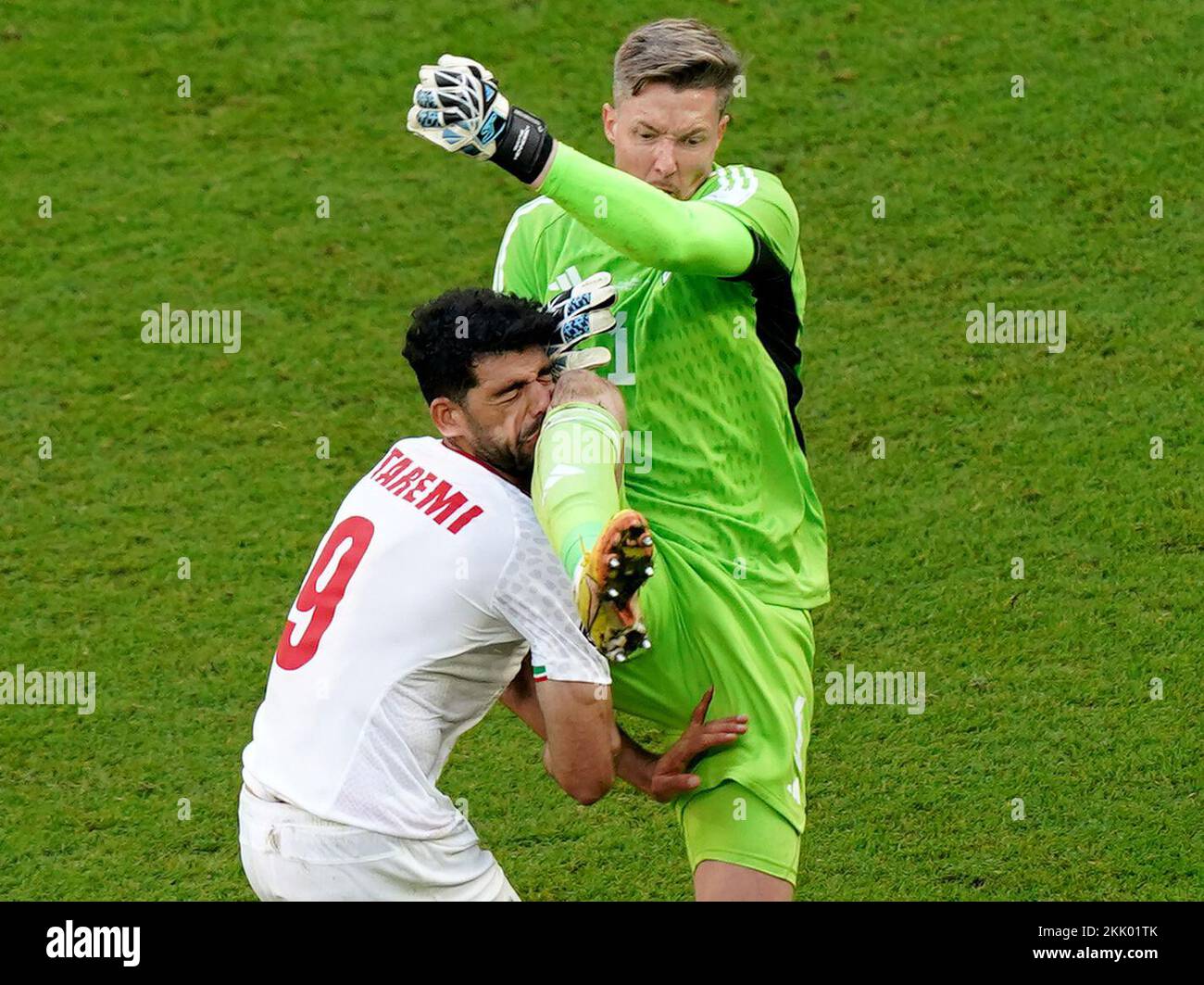 Iran’s Mehdi Taremi collides with Wales goalkeeper Wayne Hennessey ...