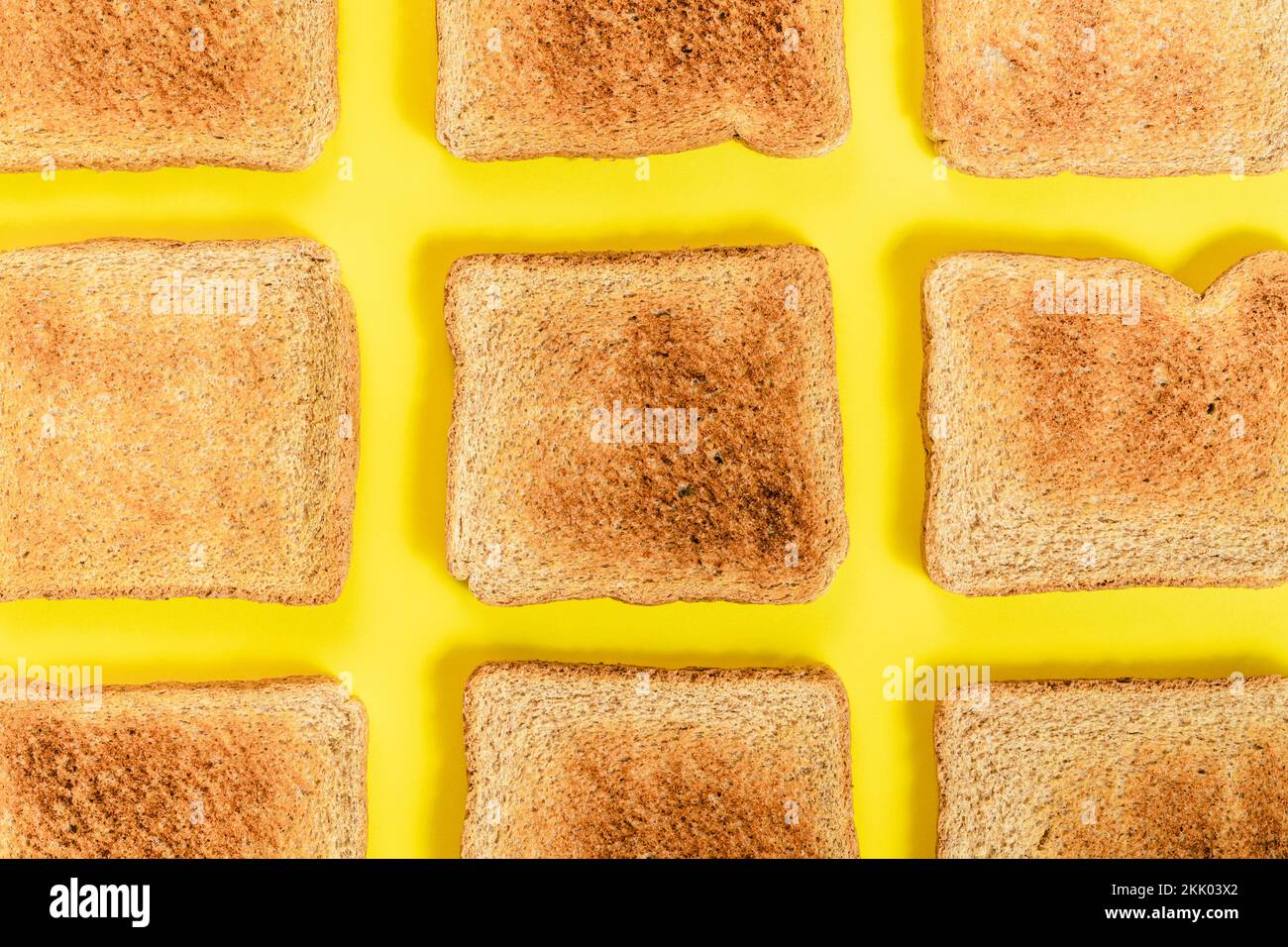 Top view of a pattern of several slices of toasted bread arranged on ...