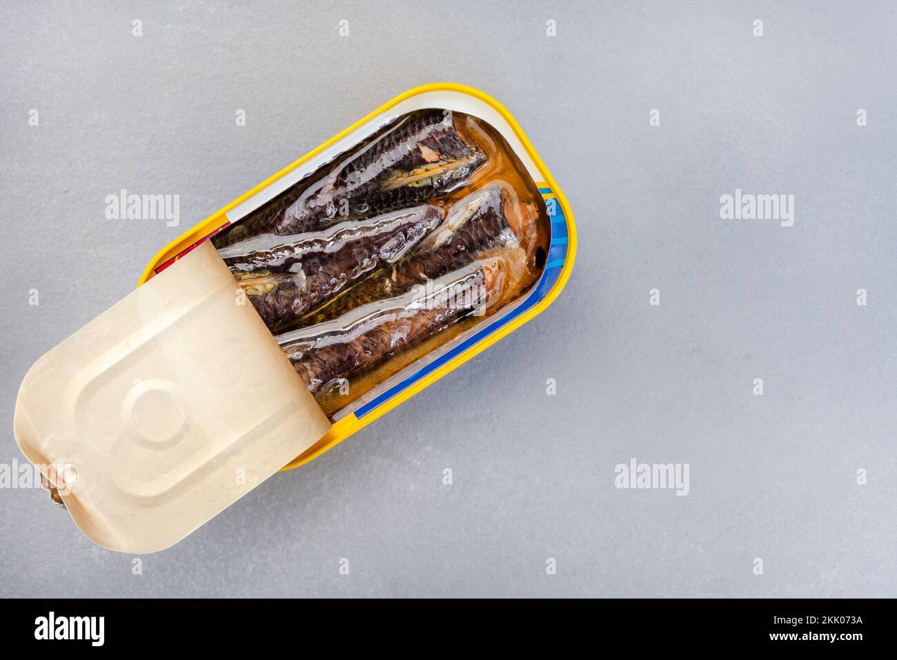 Canned sardines on gray with copy space Stock Photo - Alamy
