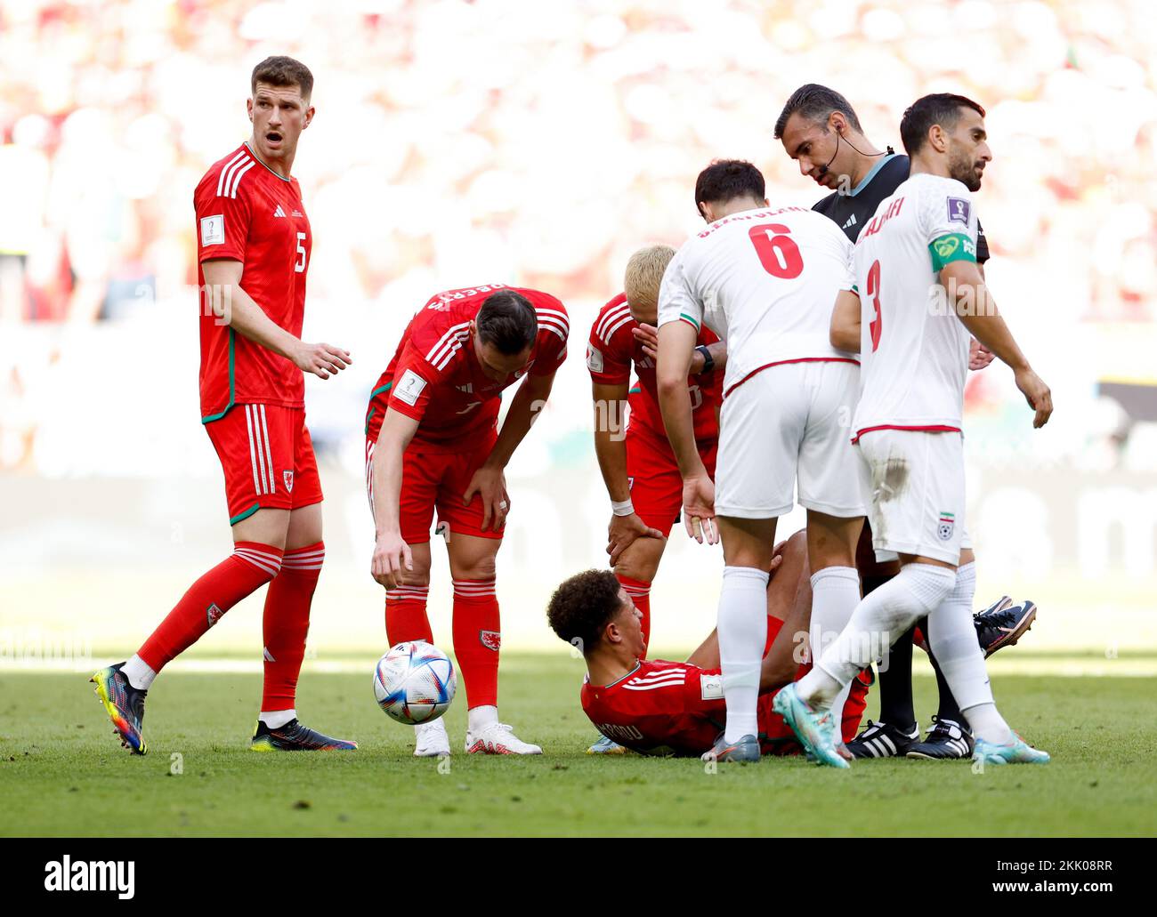Al Rayyan, Qatar. 25th Nov, 2022. Ethan Ampadu (bottom) of Wales reacts ...