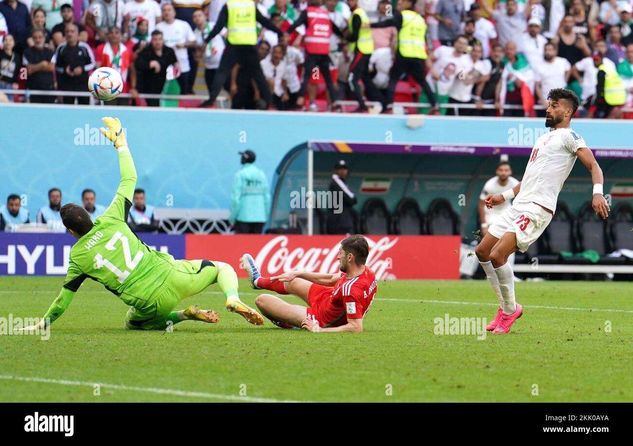 Iran's Ramin Rezaeian (right) scores their side's second goal of the ...