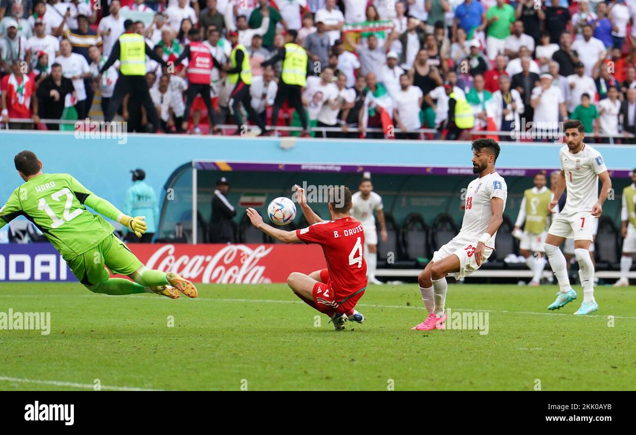 Iran's Ramin Rezaeian (right) scores their side's second goal of the ...