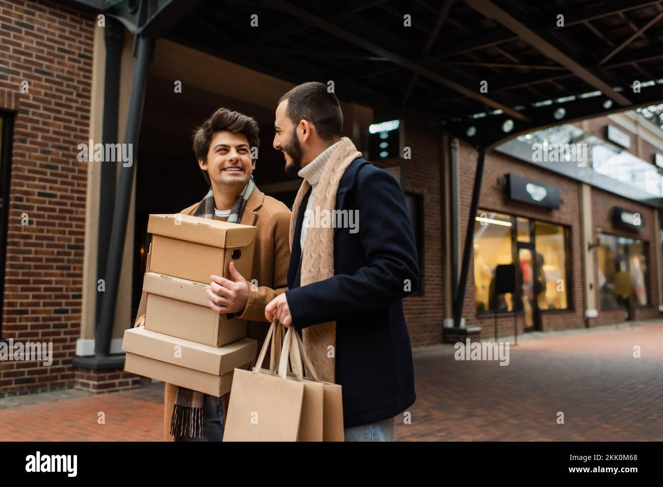 Happy gay couple looking other hi-res stock photography and images - Alamy