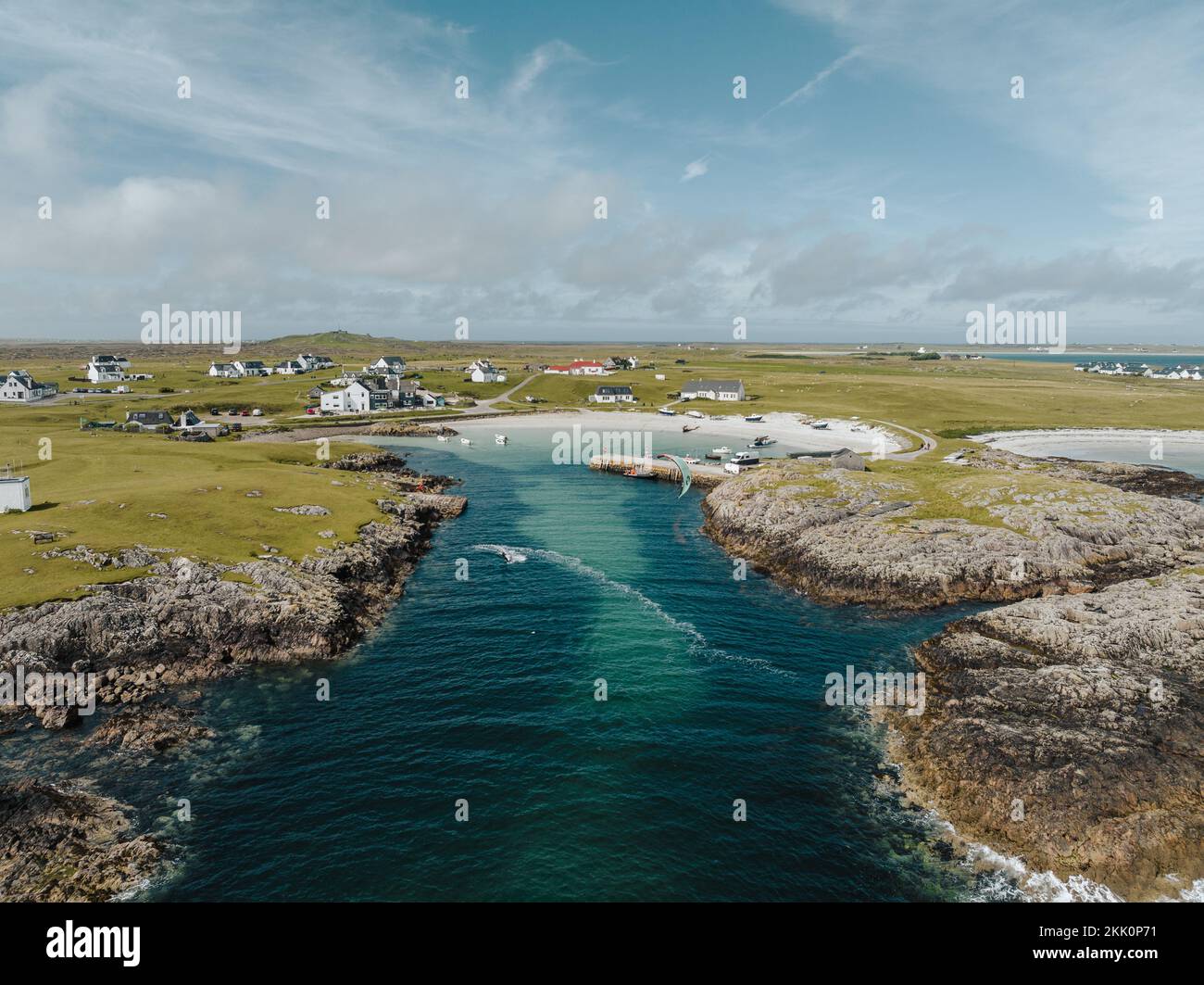 An aerial view of a sandy beach along Tiree island in Scotland with ...
