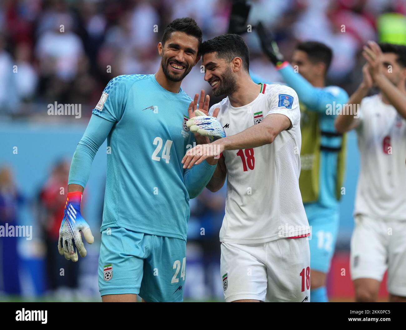 Iran goalkeeper Hossein Hosseini (left) and Ali Karimi celebrates after ...