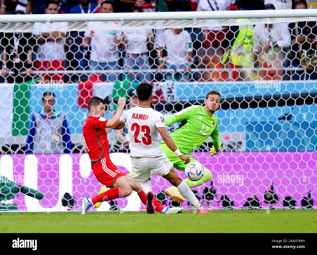 Iran's Ramin Rezaeian (centre) scores their side's second goal of the ...