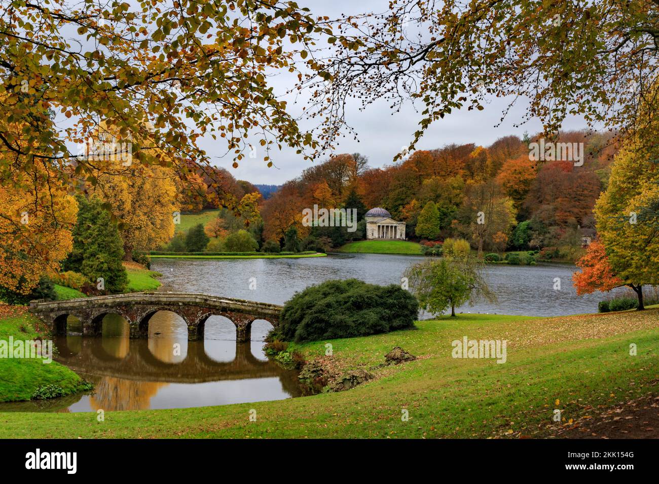 Spectacular autumn colour surrounds the historic Palladian bridge and ...
