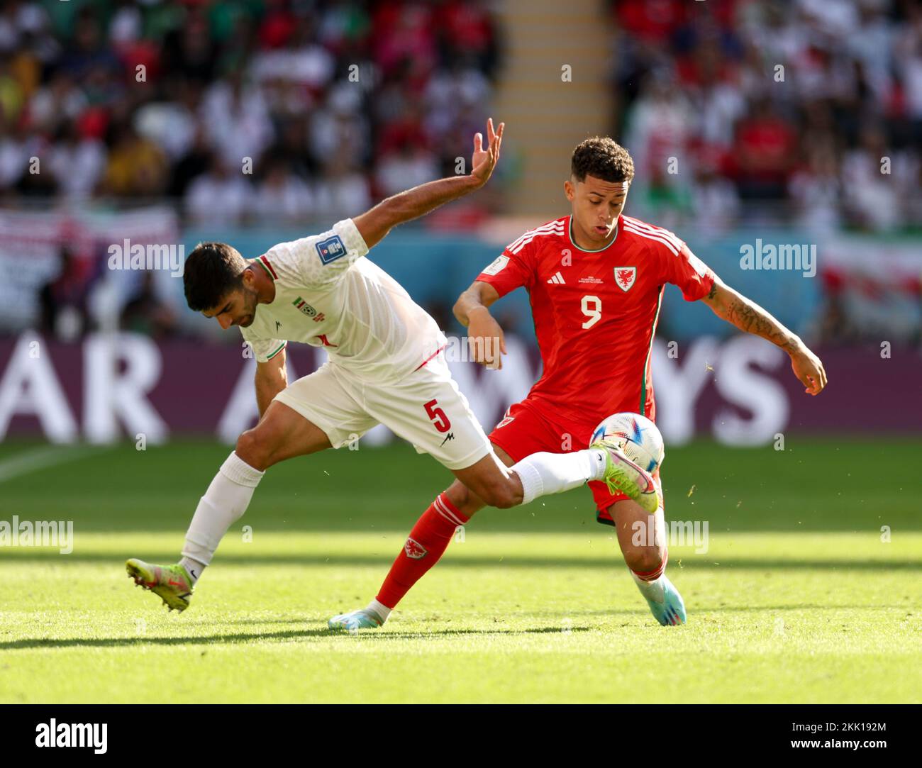 Al Rayyan, Qatar. 25th Nov, 2022. Milad Mohammadi (L) of Iran vies with ...