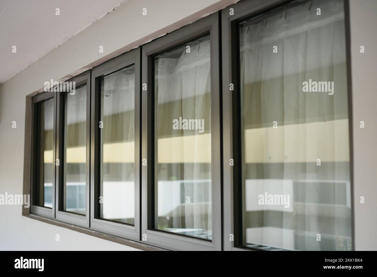Modern building with tinted windows. Urban architecture Stock Photo - Alamy