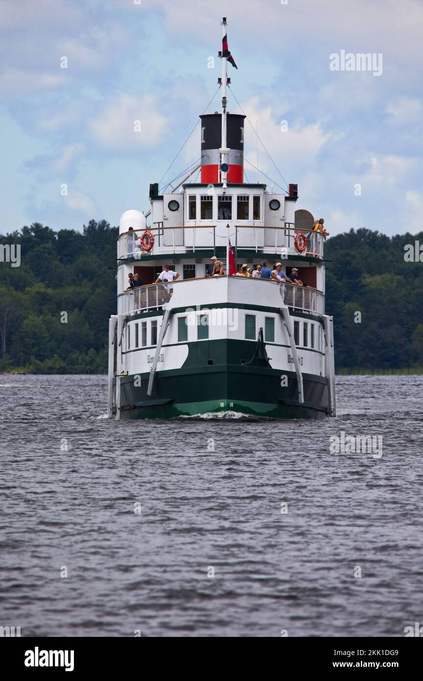 A cruise ship with its passengers enjoying the views of Lake Muskoka in ...