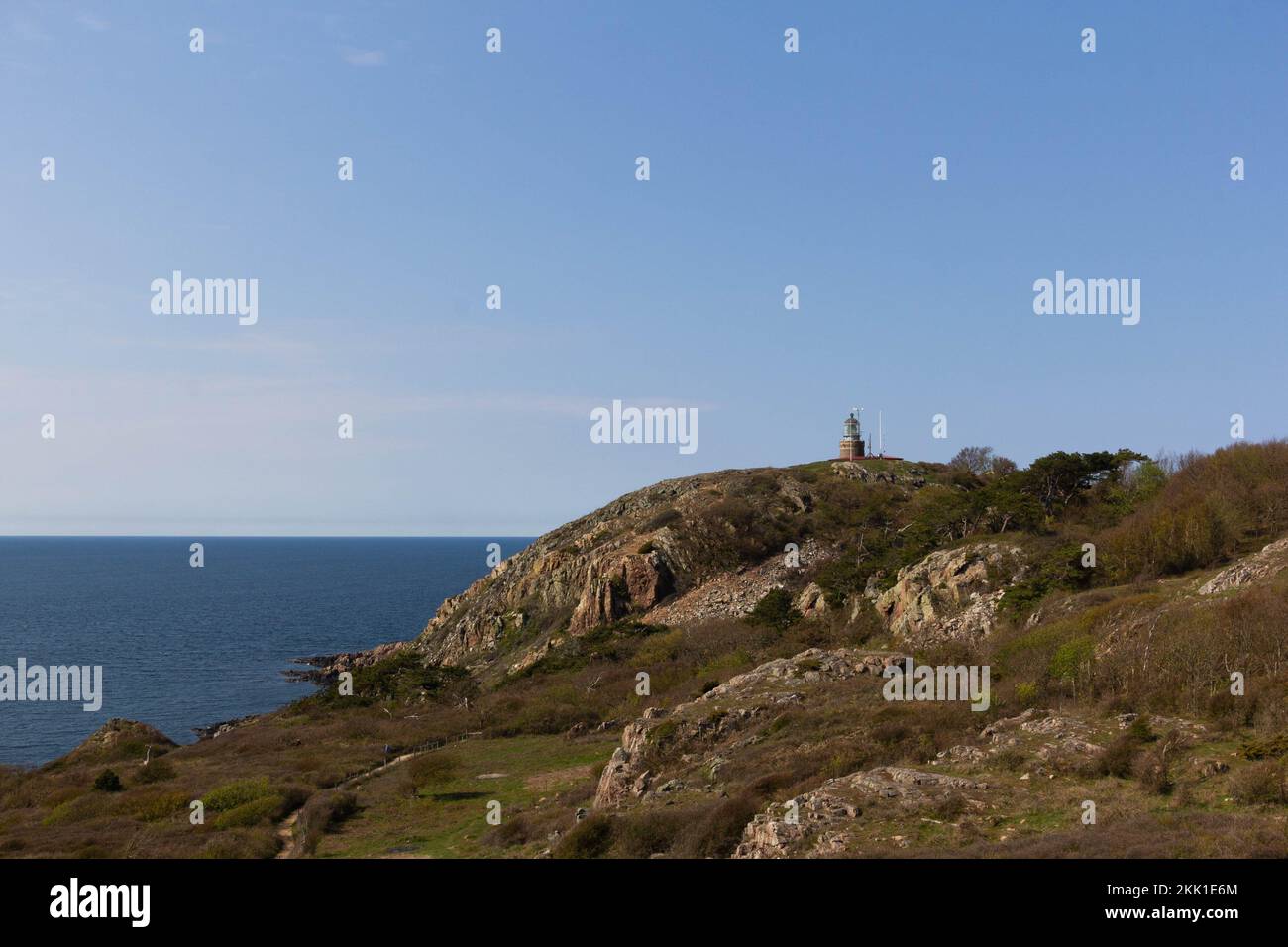 An aerial view of a cliff overlooking the ocean with the Kullen ...