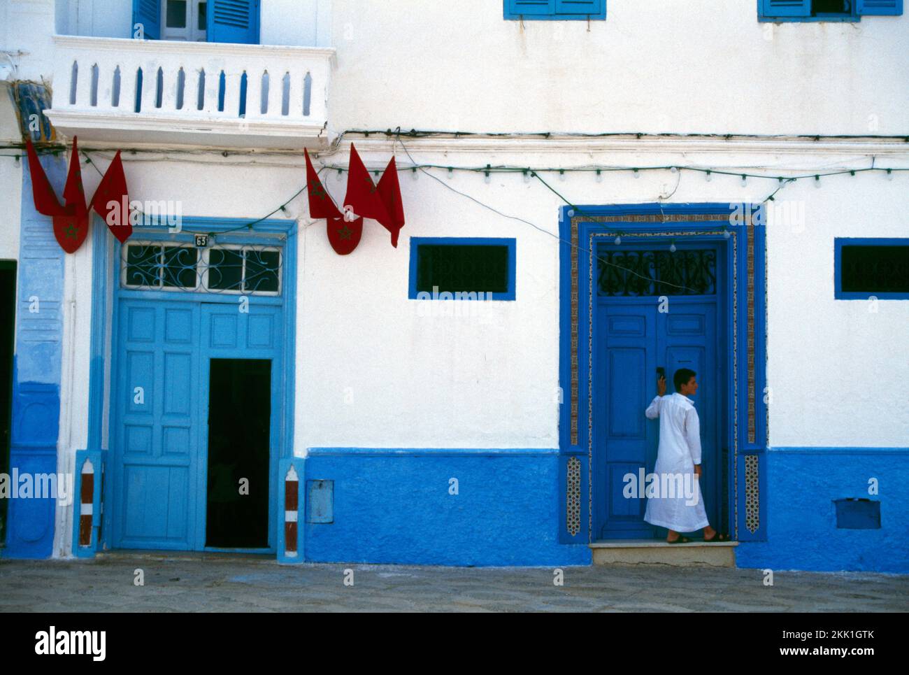 Asilah Morocco Man Knocking on Door of House Stock Photo - Alamy