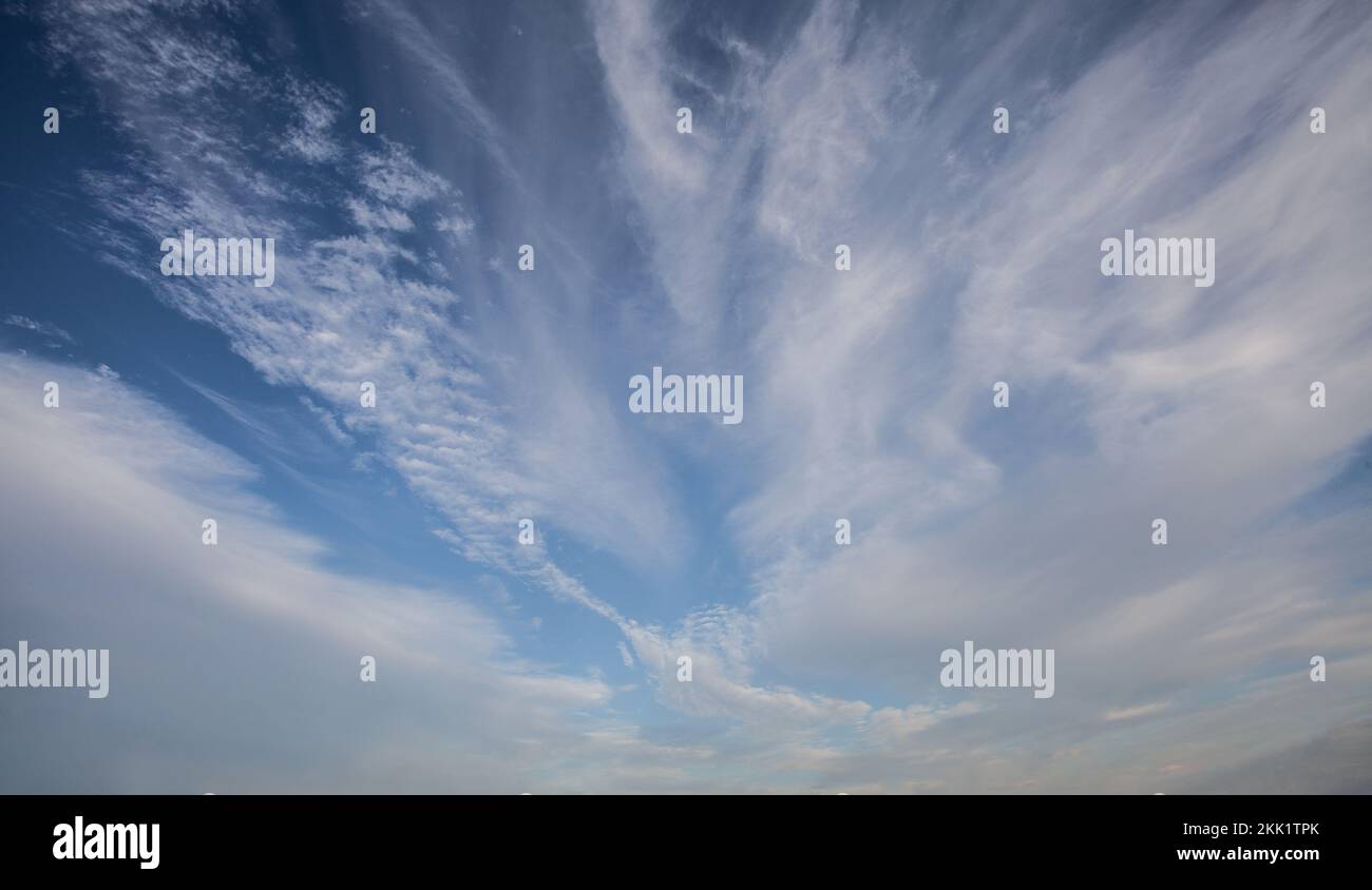 Blue cold winter sky background with cumulus clouds Stock Photo - Alamy
