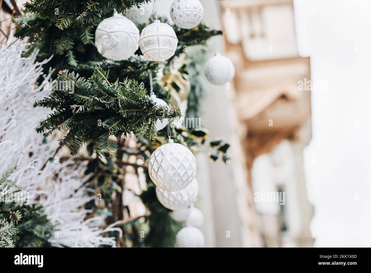 Christmas outdoor decoration on building. Pine branches and classical ...