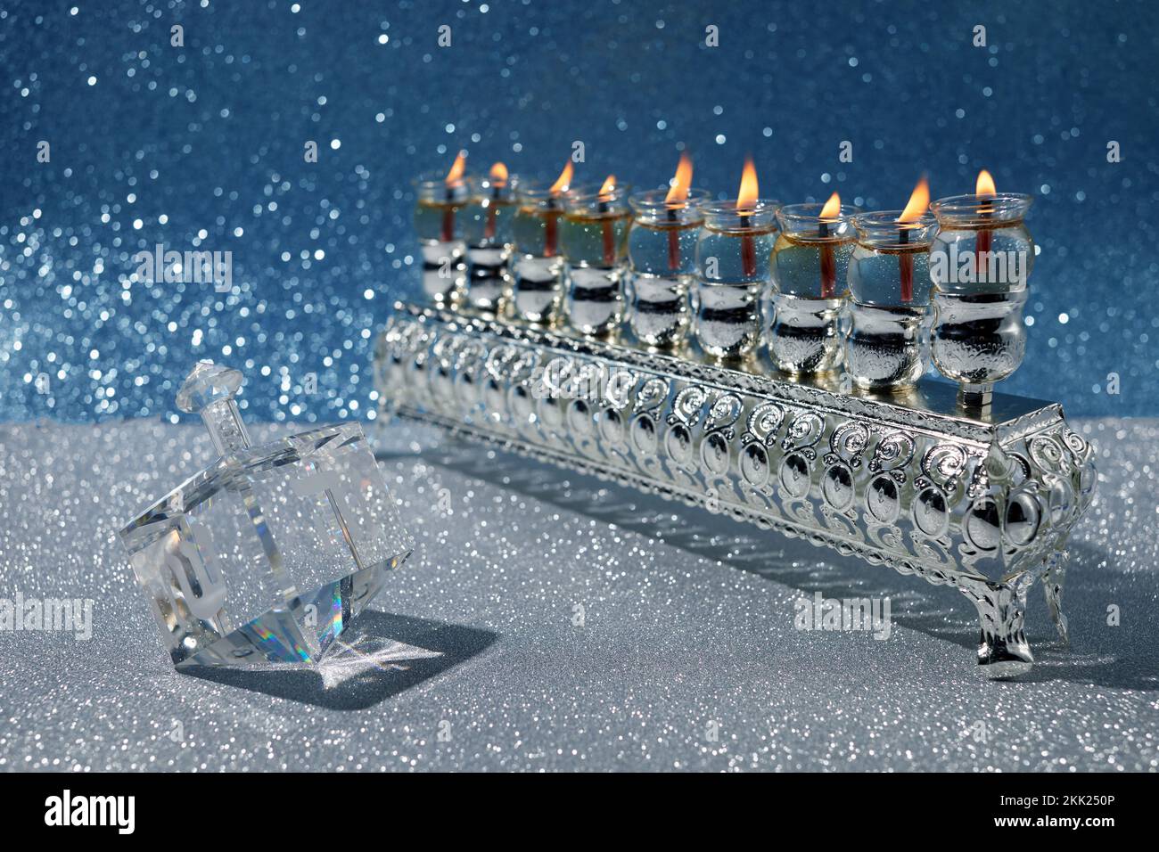 Jewish holiday Hanukkah background with oil menorah and dreidel with ...