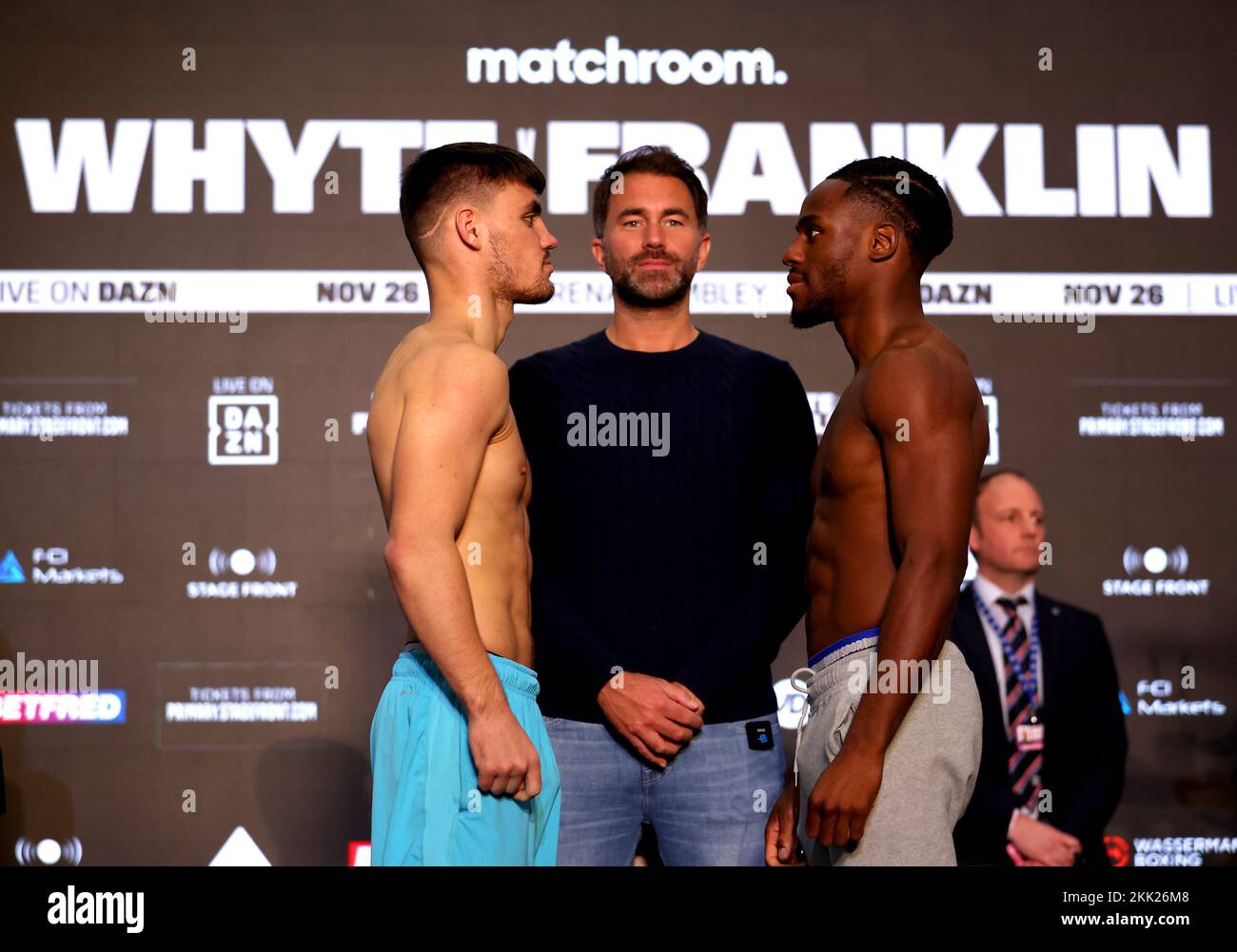 Boxing promoter Eddie Hearn (centre) stands inbetween Mark Dickinson ...