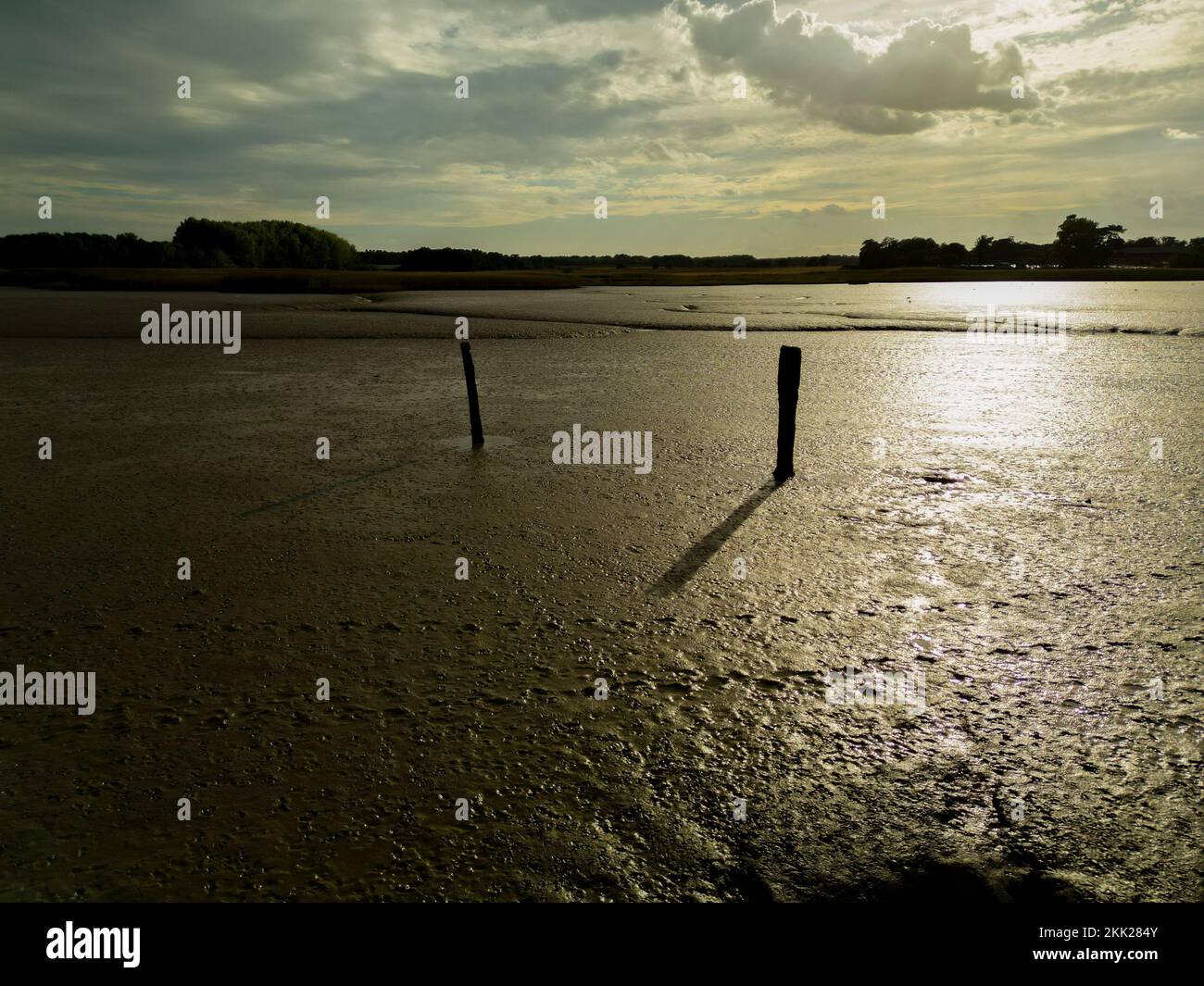 A landscape of a low tide old water break during the sunrise Stock ...