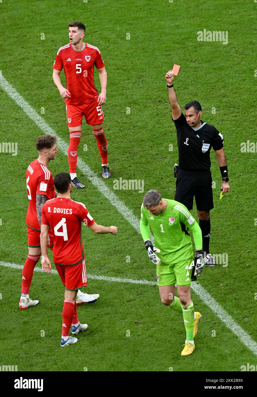 Al Rayyan, Qatar. 25th Nov, 2022. Referee Mario Escobar (top R) shows a ...