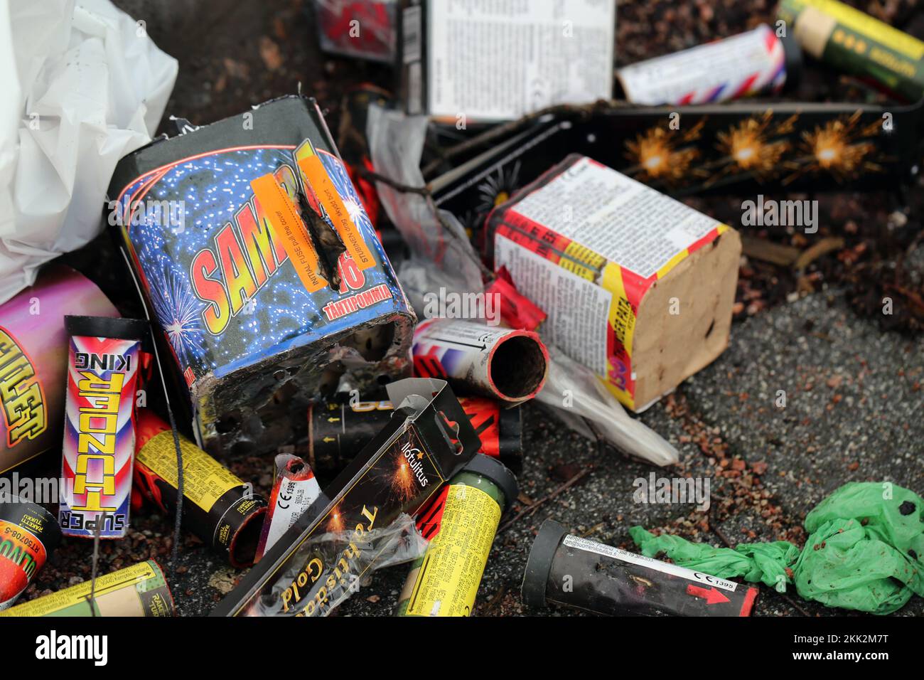 Firework trash left on the ground at New Year's Day. Colorful trash ...