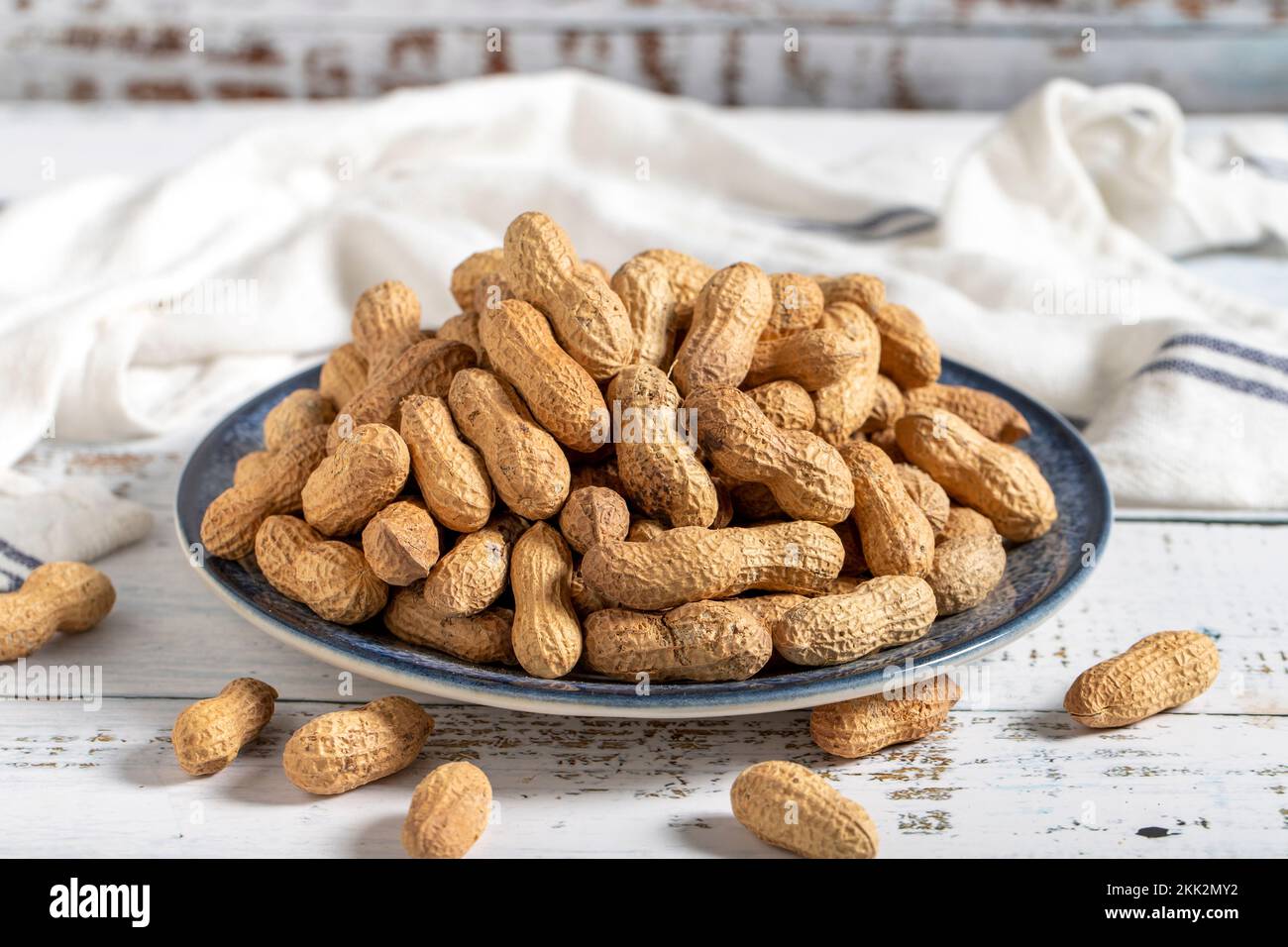 Peanut in shell on wooden background. Healthy food Stock Photo - Alamy