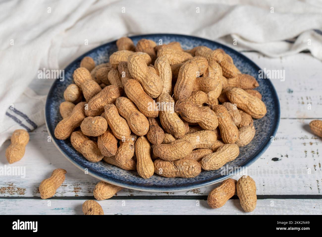 Peanut in shell on wooden background. Healthy food Stock Photo - Alamy