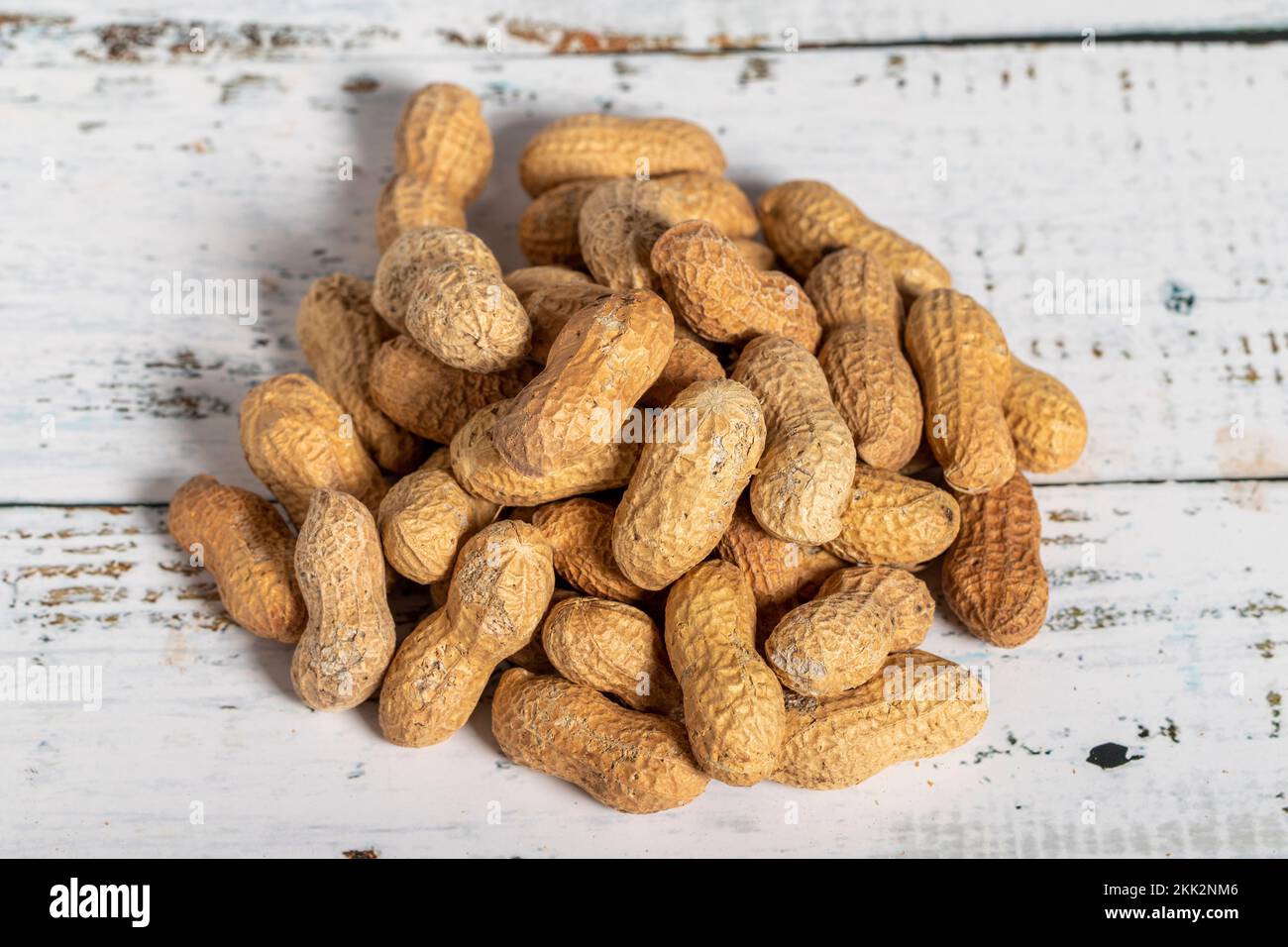 Peanut in shell on wooden background. Healthy food Stock Photo - Alamy