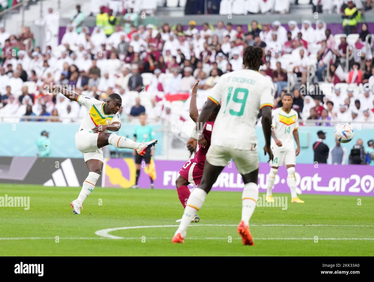 Doha, Qatar. 25th Nov, 2022. Nampalys Mendy (1st L) of Senegal shoots during the Group A match ...