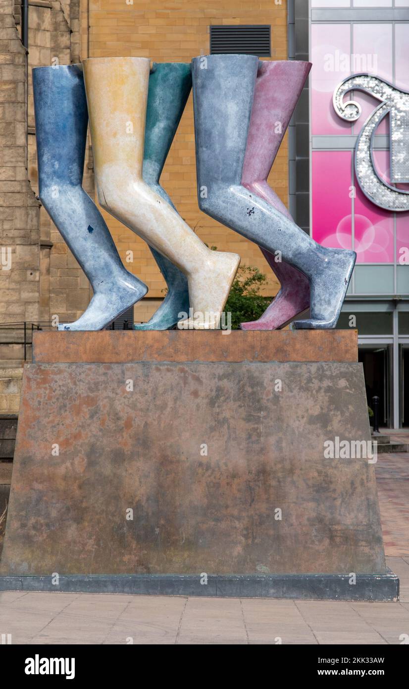 A vertical closeup of colorful Legs Walking sculpture near Leeds ...