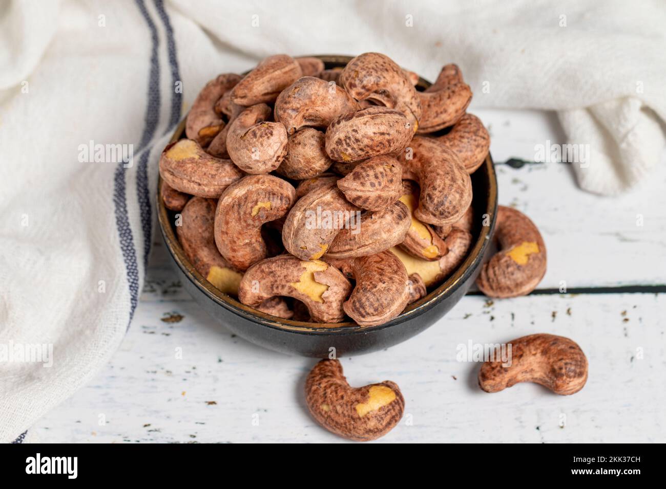 Cashew nuts on wood background. Raw cashews. Healthy food. close up ...