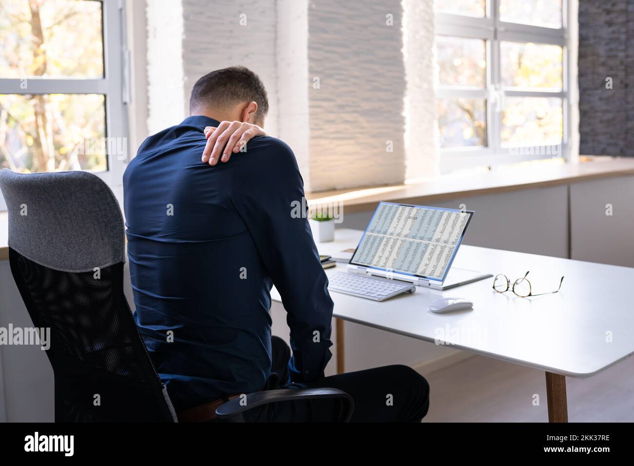 Man With Back Pain. Bad Office Posture Stock Photo - Alamy