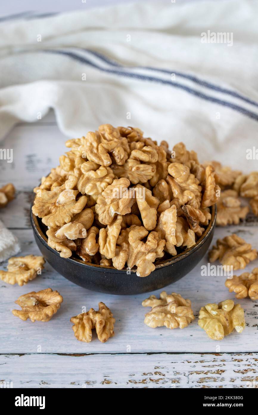 Walnut kernel on wood floor. Nuts. Healthy food. close up Stock Photo ...
