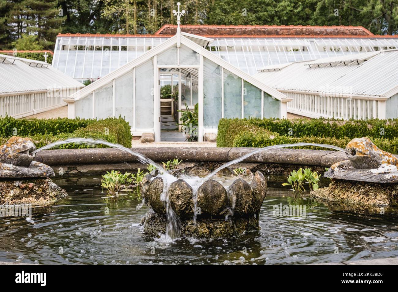 An ornamental fountain and greenhouses at Eythrope Gardens on the ...