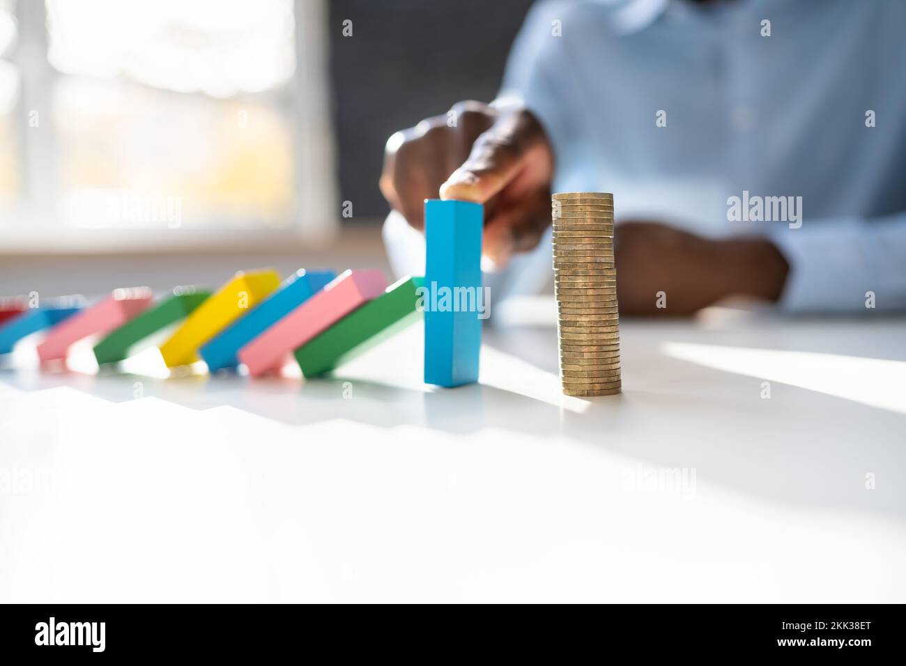 American African Hand Protecting Cash Money From Domino Risk Stock ...