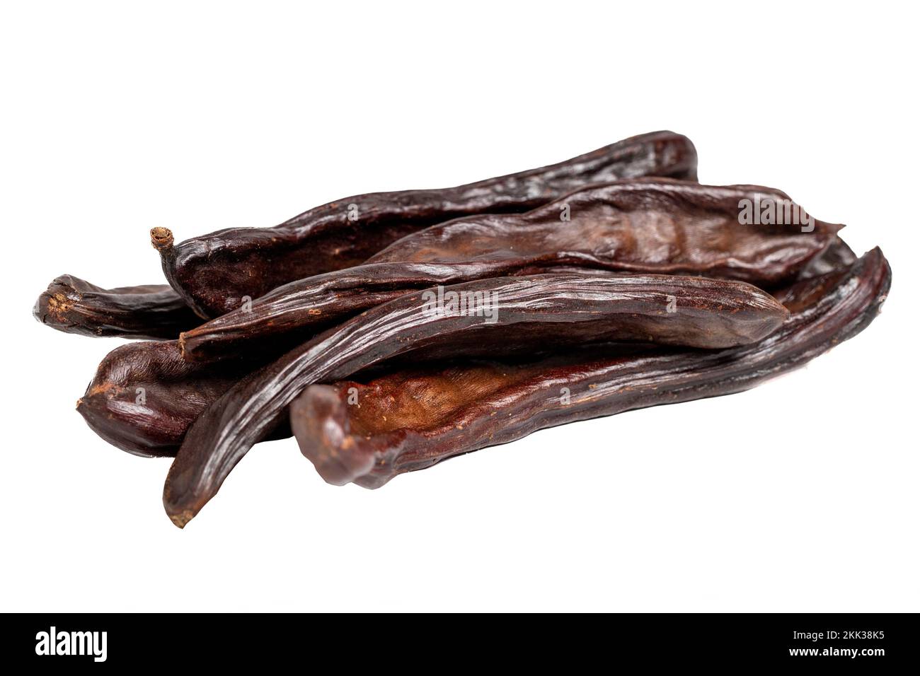 Carob isolated on a white background. healthy food. close up Stock ...