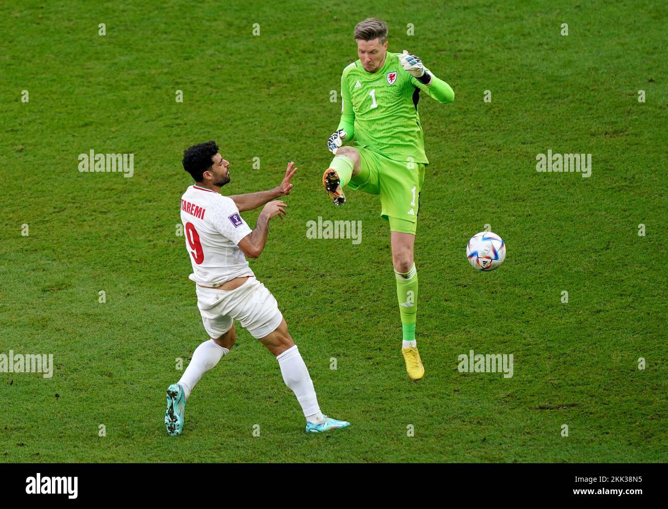 Iran’s Mehdi Taremi collides with Wales goalkeeper Wayne Hennessey ...