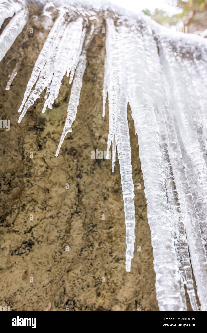Icicles crystal on the frozen stone. Outdoor and winter Stock Photo - Alamy