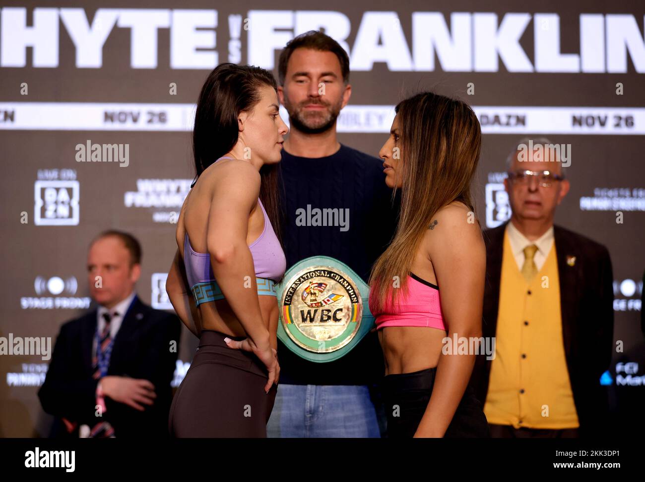 Boxing promoter Eddie Hearn (centre) stands inbetween Sandy Ryan (left) and Anahi Ester Sanchez ...