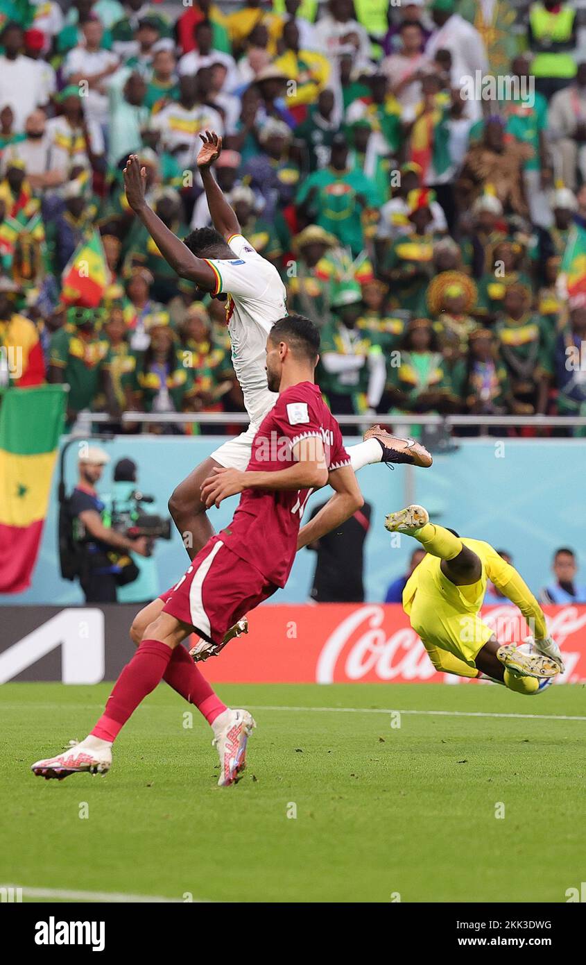 Doha, Qatar. 25th Nov, 2022. Meshaal Barsham (1st R), goalkeeper of ...
